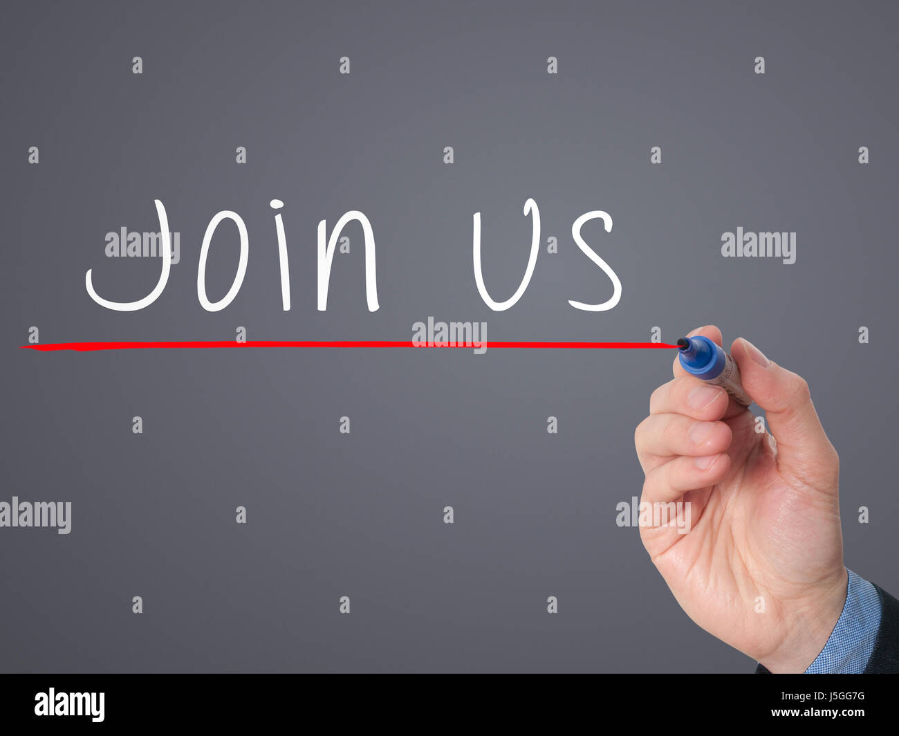 join us words written by businessman hand on a transparent board ...