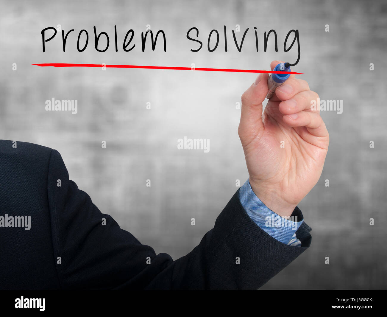 Businessman is writing Problem Solving on the transparent board ...