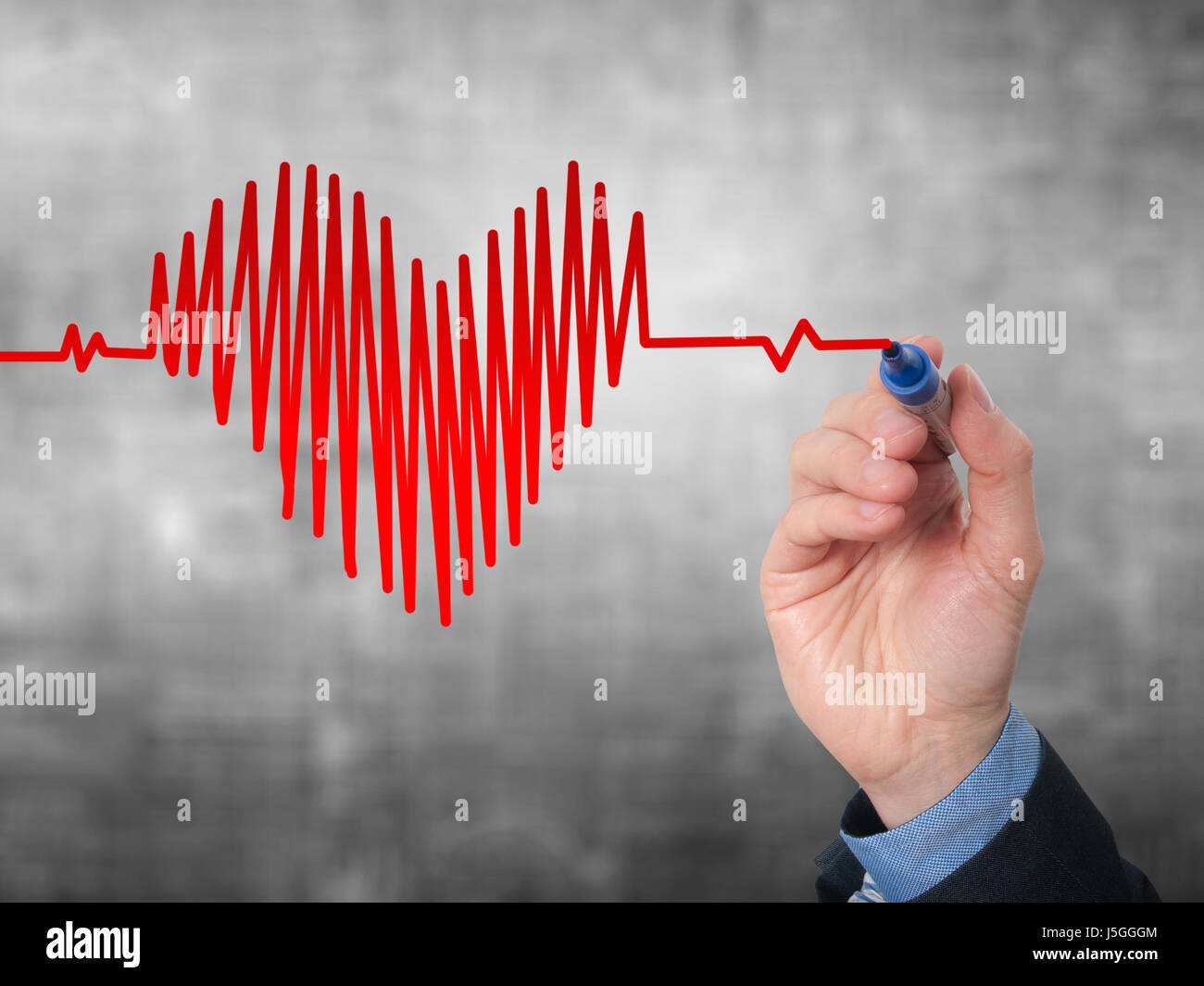 Businessman hand drawing chart heartbeat. Isolated on grey background ...