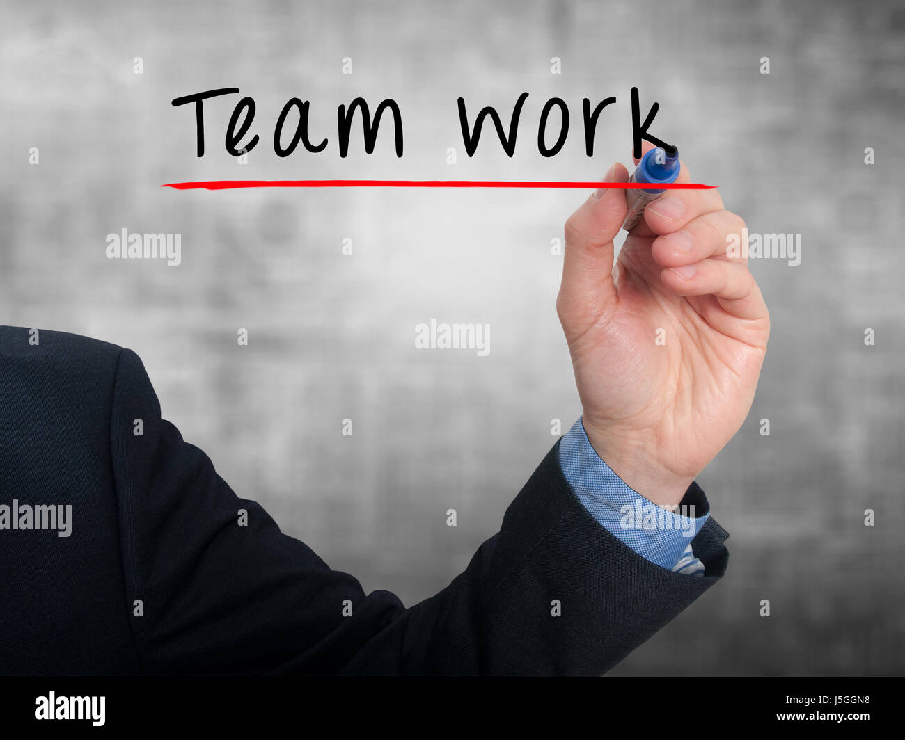Team work concept businessman hand writing Team work. Grey - Stock ...
