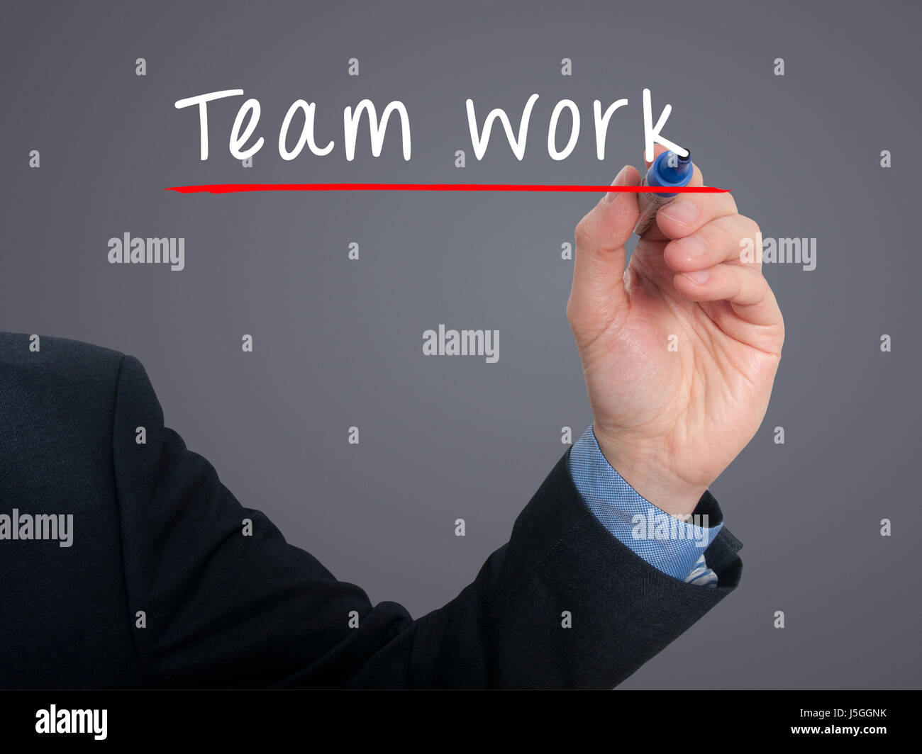 Team work concept businessman hand writing Team work. Grey - Stock ...