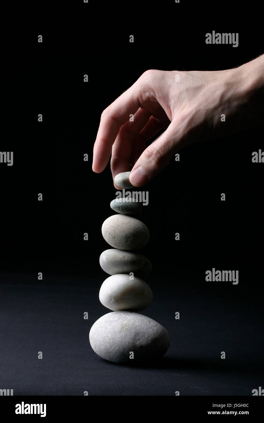 stones with hand Stock Photo - Alamy