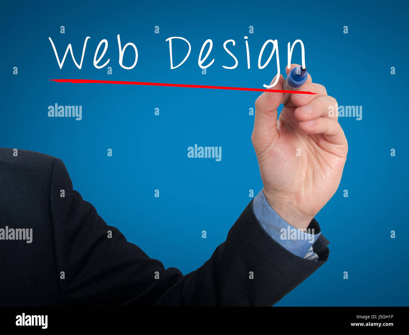 Businessman writing Web Design concept. Isolated on blue background ...