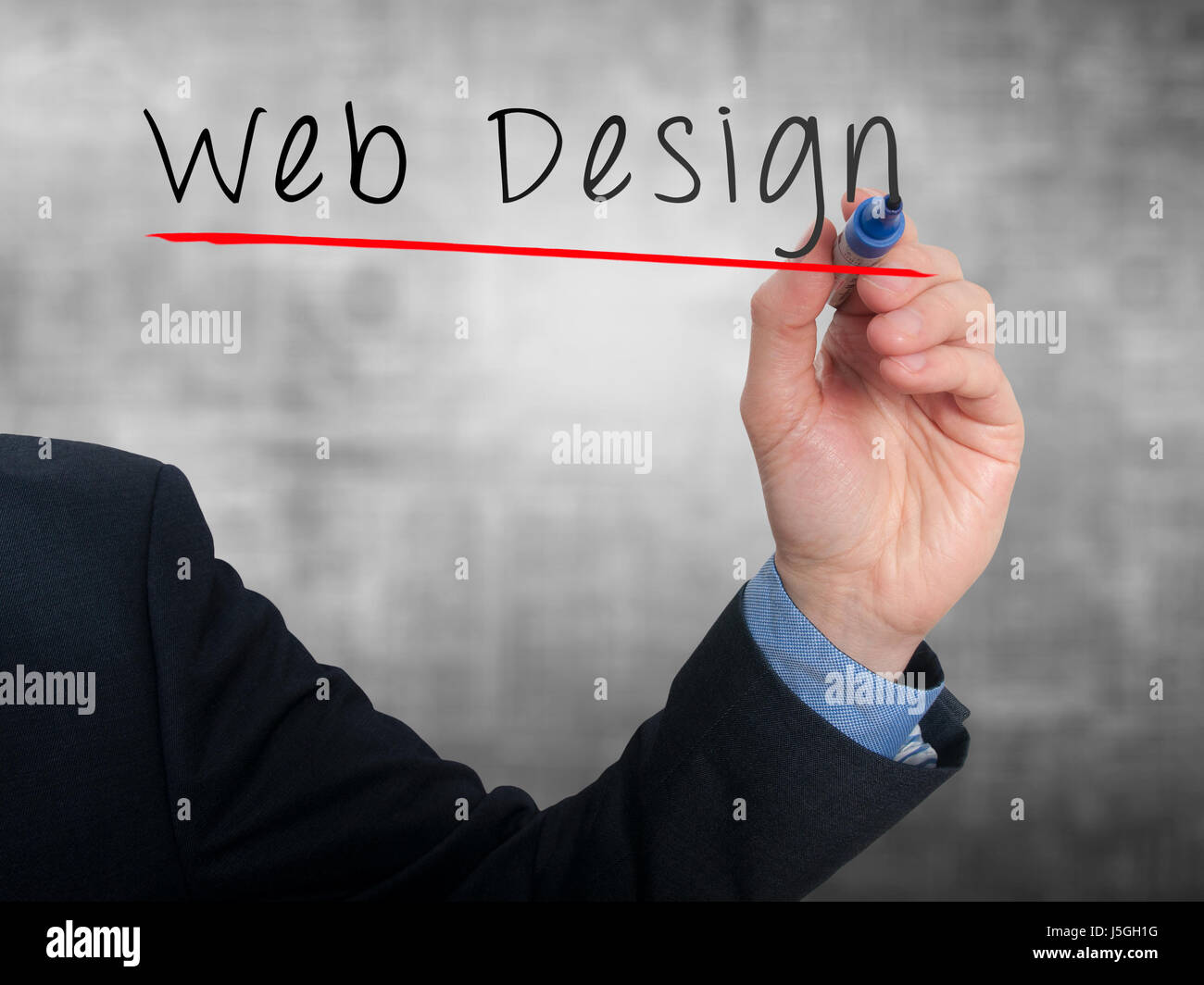 Businessman writing Web Design concept. Isolated on grey background ...