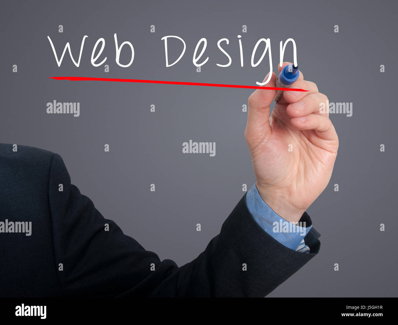 Businessman writing Web Design concept. Isolated on grey background ...