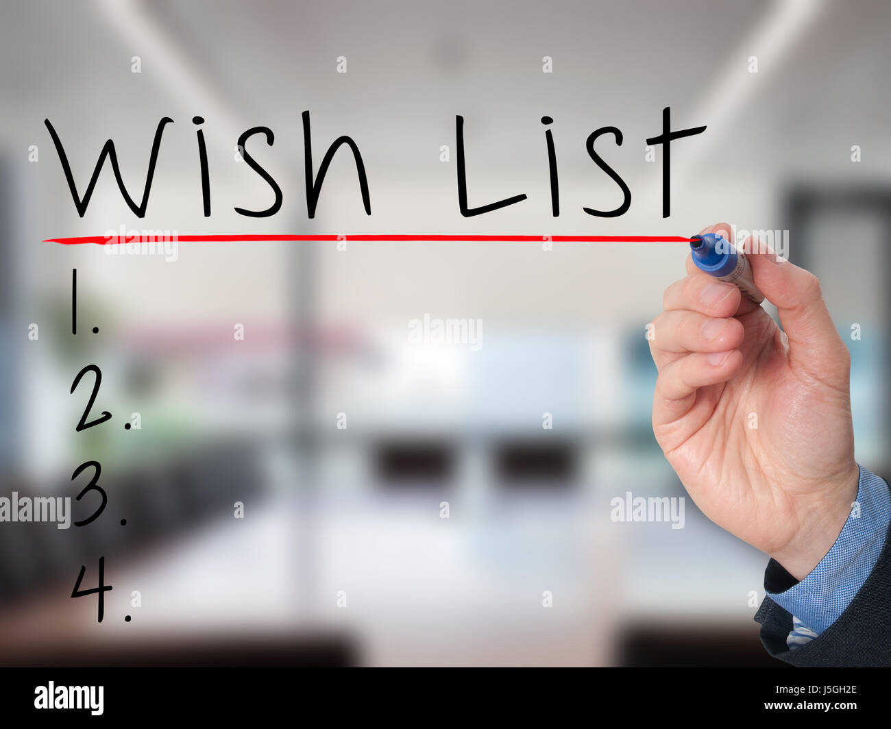 Businessman is writing wish lists on whiteboard. Wish list concept ...