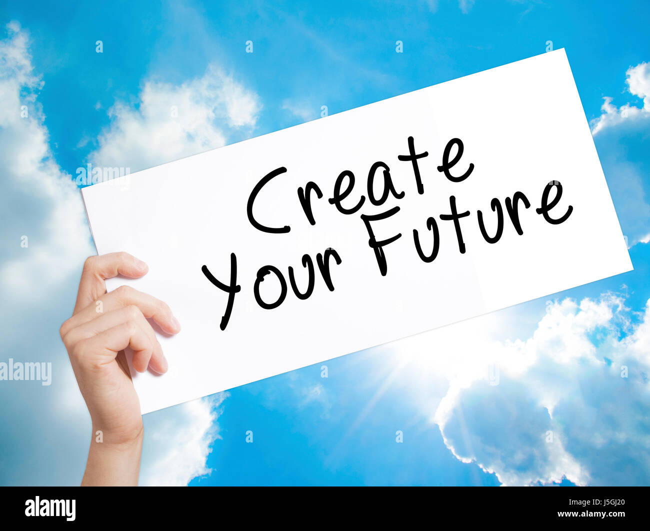 Create Your Future Sign on white paper. Man Hand Holding Paper with ...