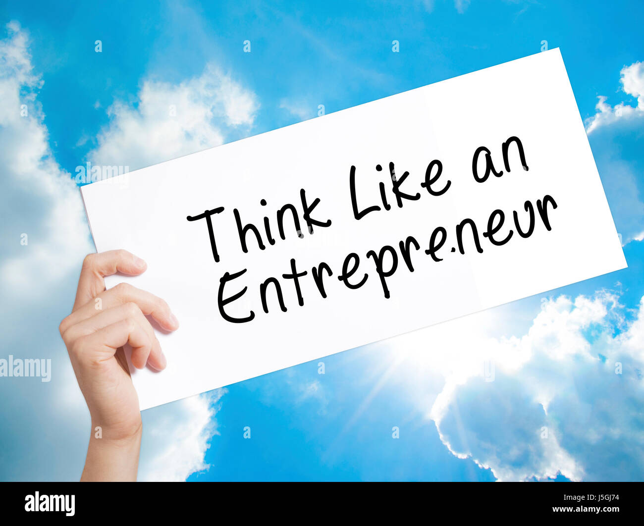 Think Like an Entrepreneur Sign on white paper. Man Hand Holding Paper ...