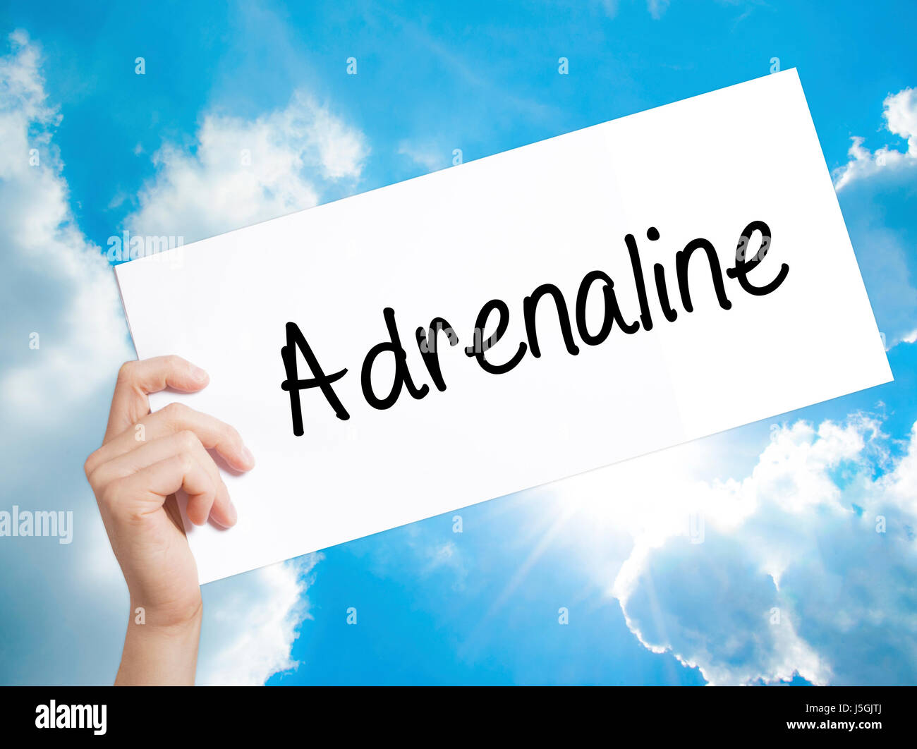 Adrenaline Sign on white paper. Man Hand Holding Paper with text ...
