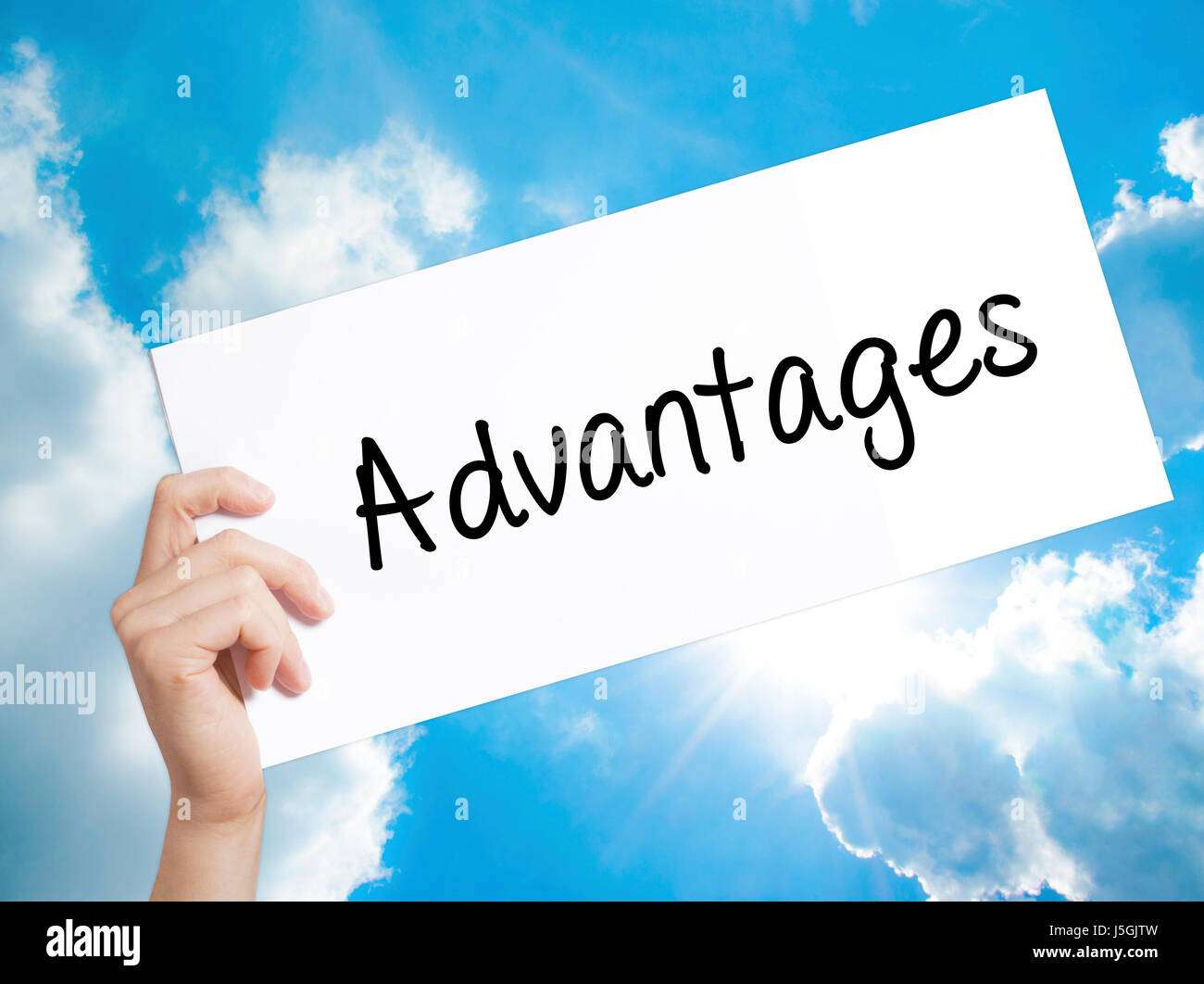 Advantages Sign on white paper. Man Hand Holding Paper with text ...
