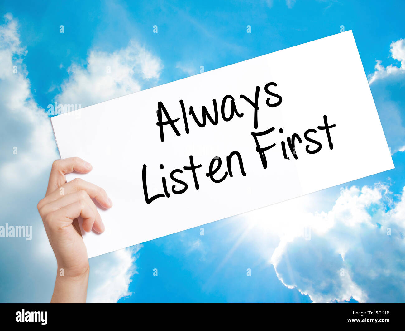 Always Listen First Sign on white paper. Man Hand Holding Paper with ...