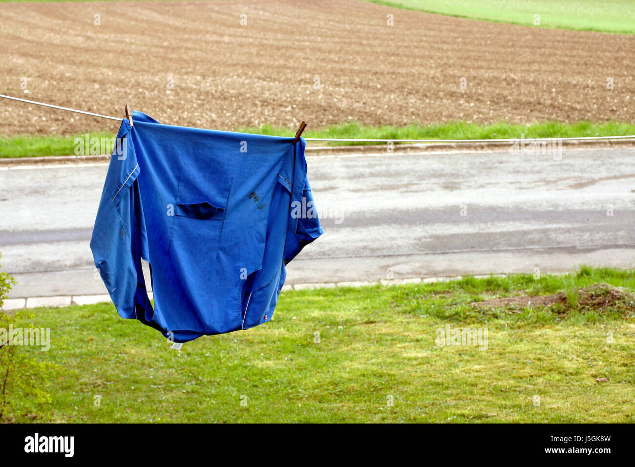 smock blue horizontal outside working clothes shirt hang dry ...