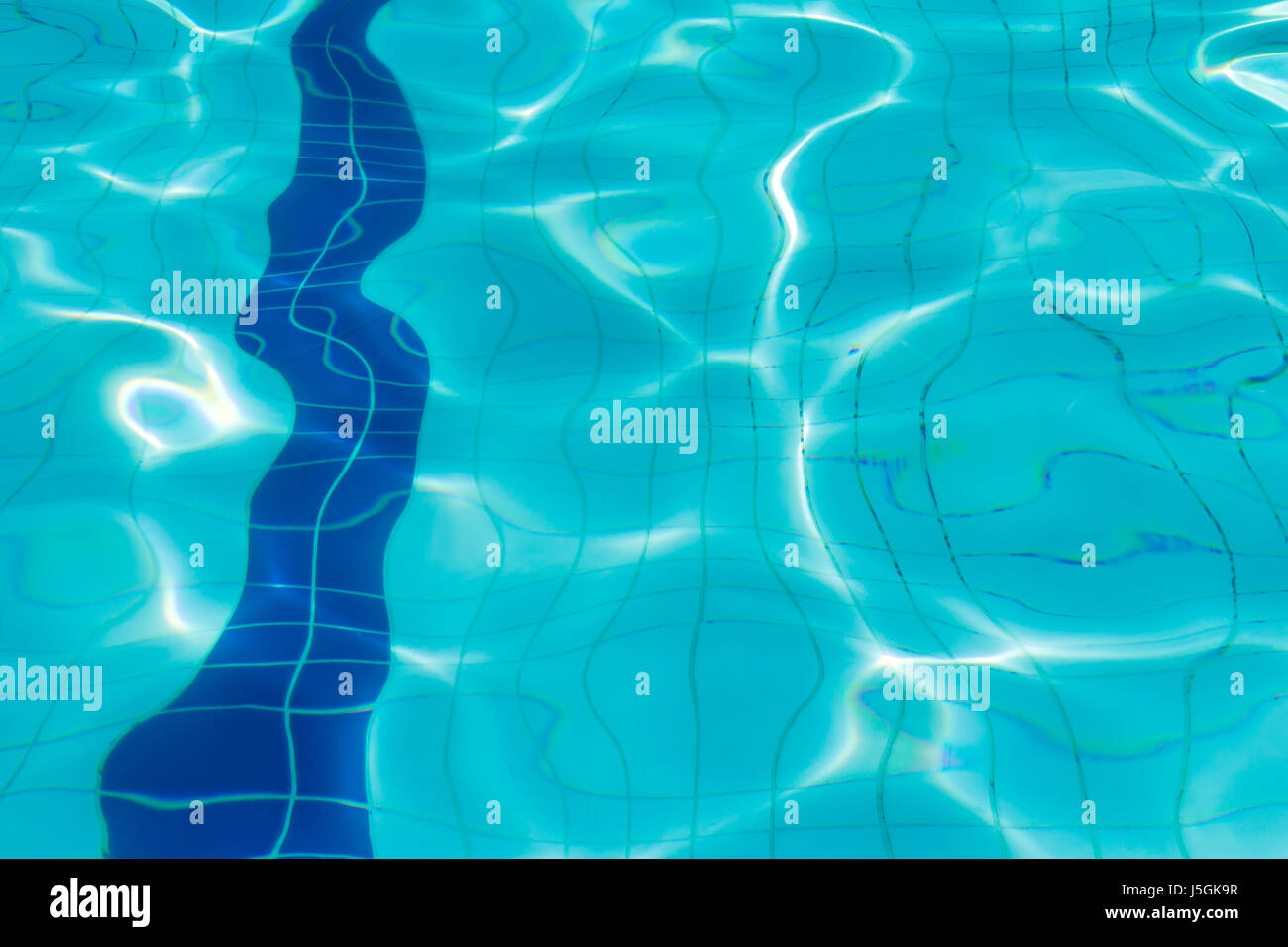 Blue ripple water in swimming pool Stock Photo - Alamy