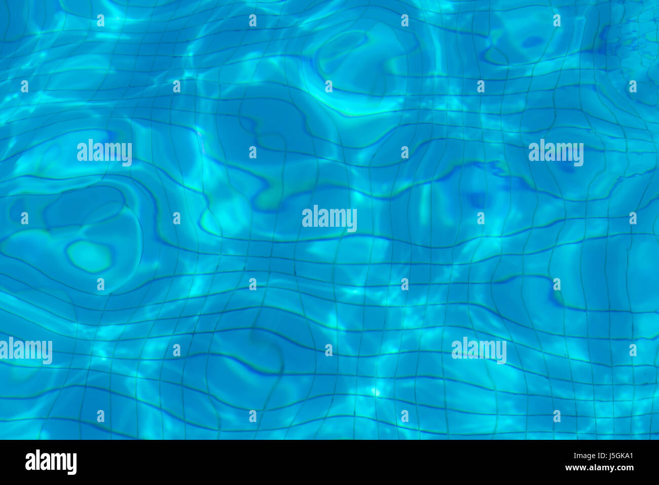 Blue ripple water in swimming pool Stock Photo - Alamy