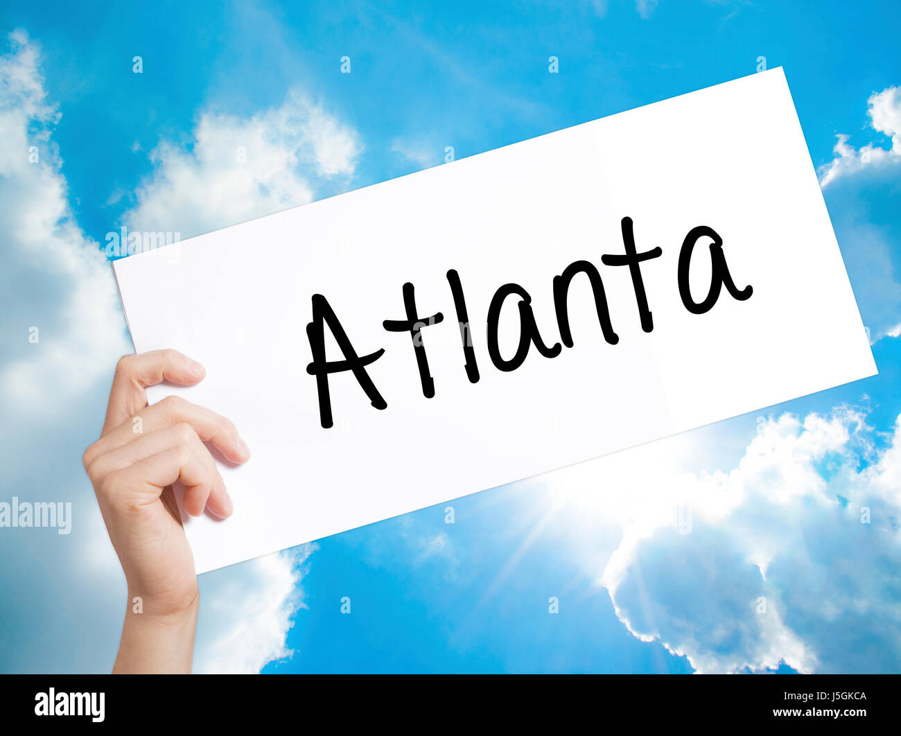 Atlanta Sign on white paper. Man Hand Holding Paper with text. Isolated ...