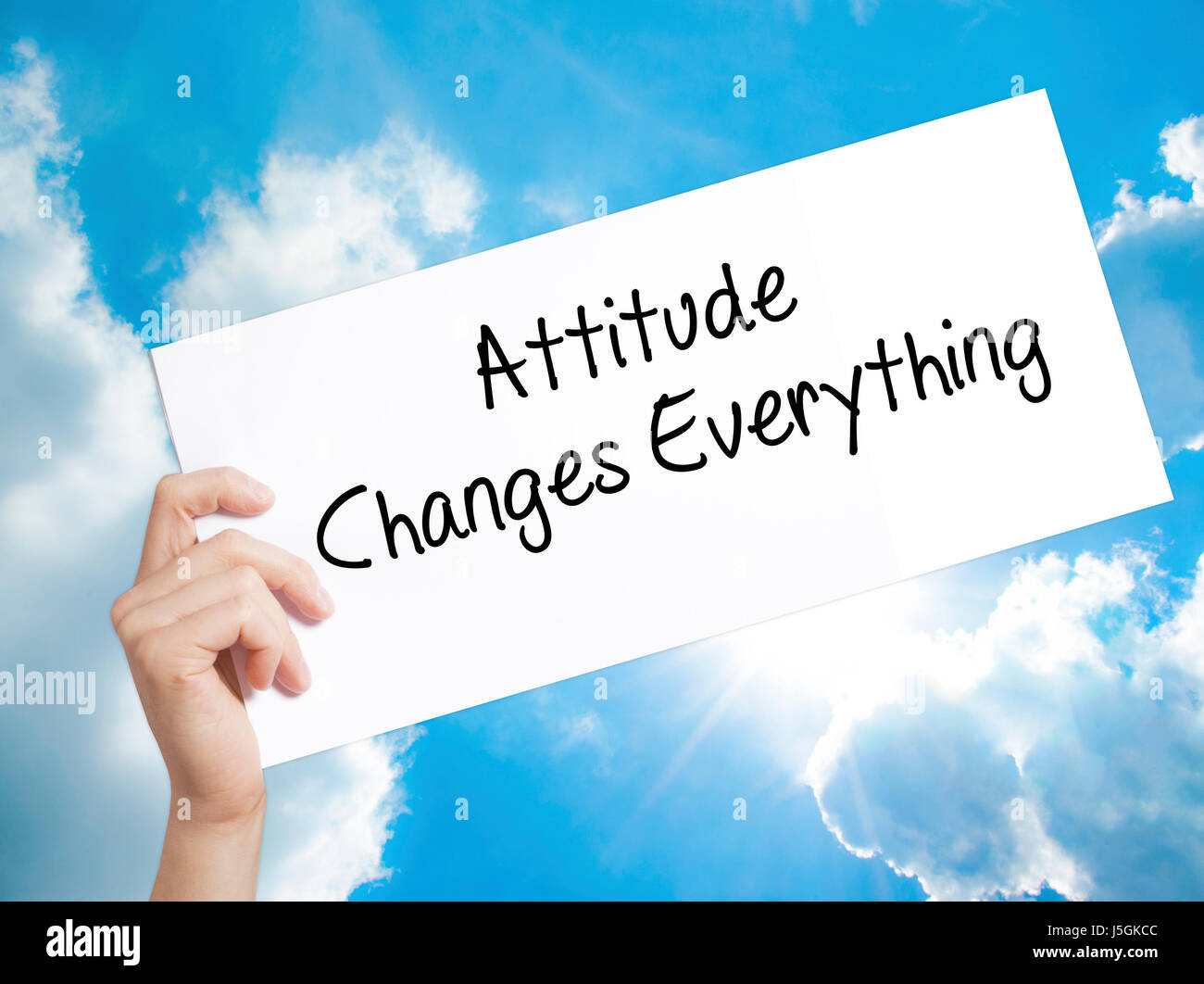 Attitude Changes Everything Sign on white paper. Man Hand Holding Paper ...
