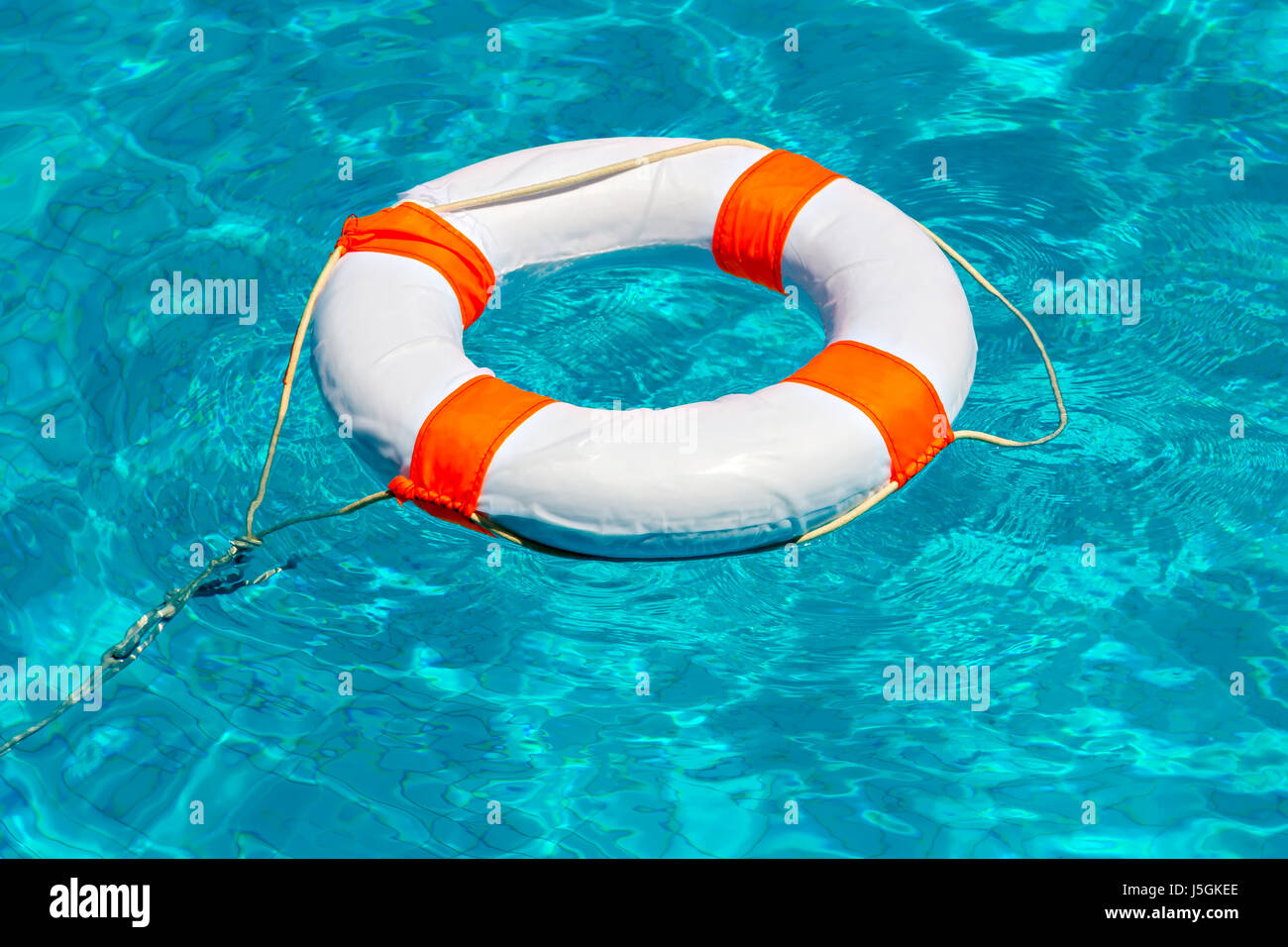 Life buoy in swimming pool Stock Photo - Alamy