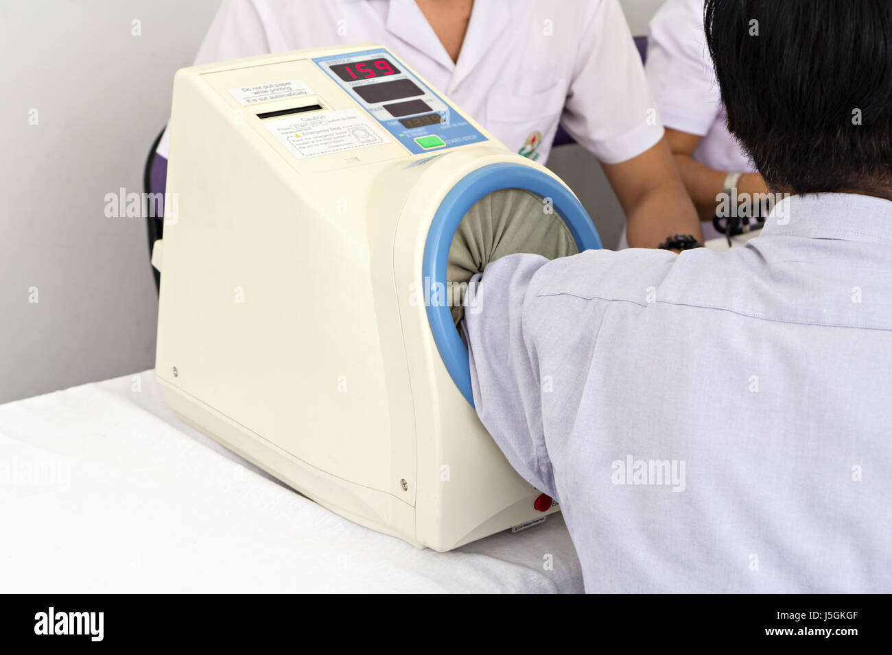 Automatic blood pressure monitor for health check Stock Photo - Alamy