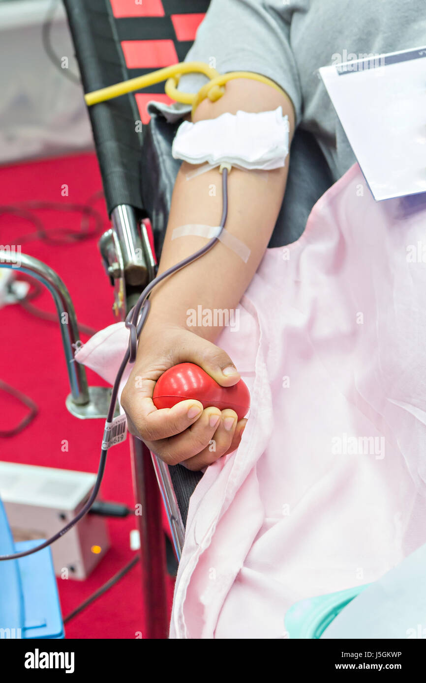 Blood Donor Making Donation with a bouncy ball holding in hand Stock ...