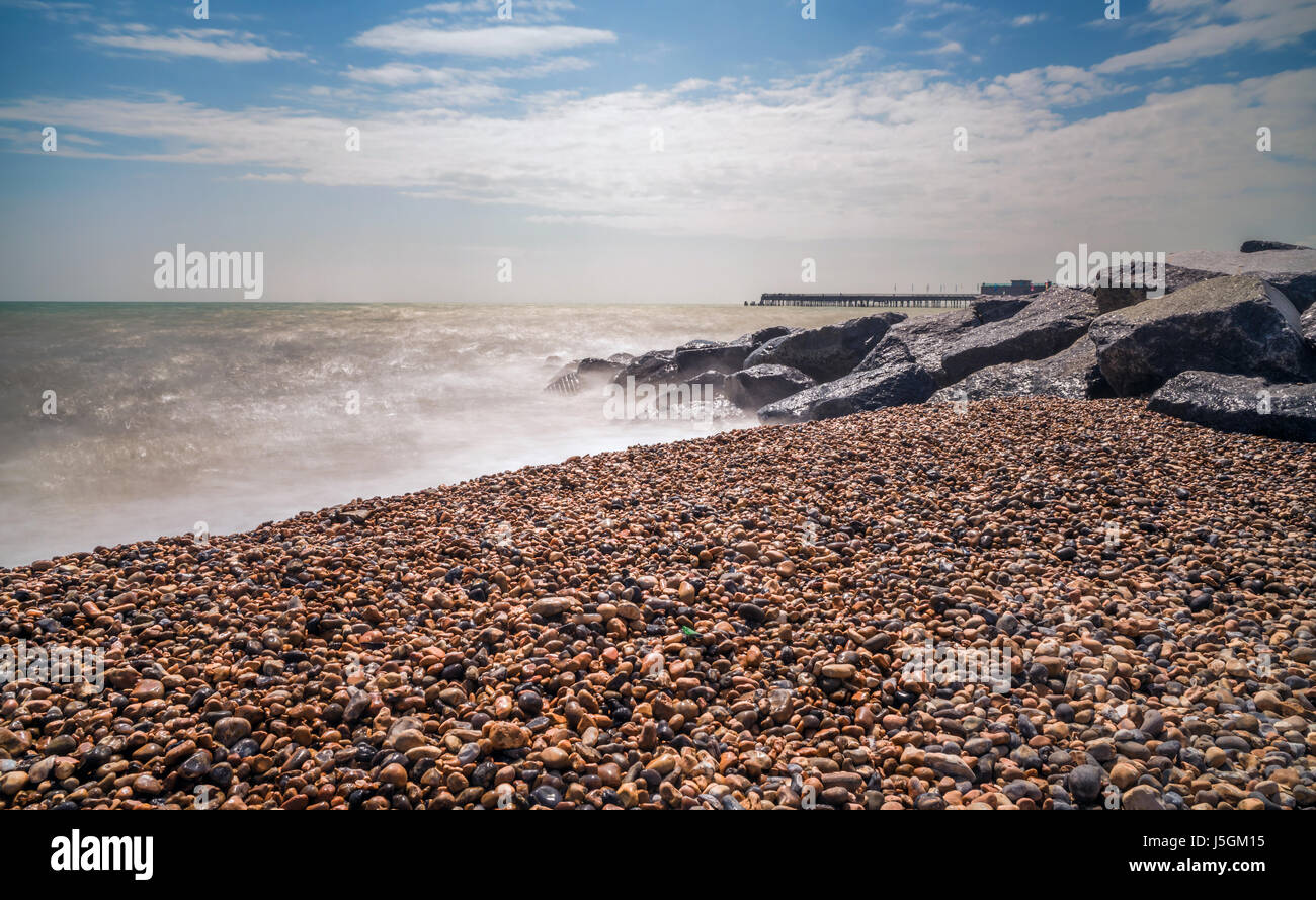 Stony beach in Hastings and a new pier in a distance Stock Photo - Alamy