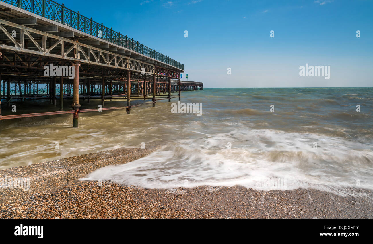 A pier and stony beach in Hastings, East Sussex UK Stock Photo - Alamy