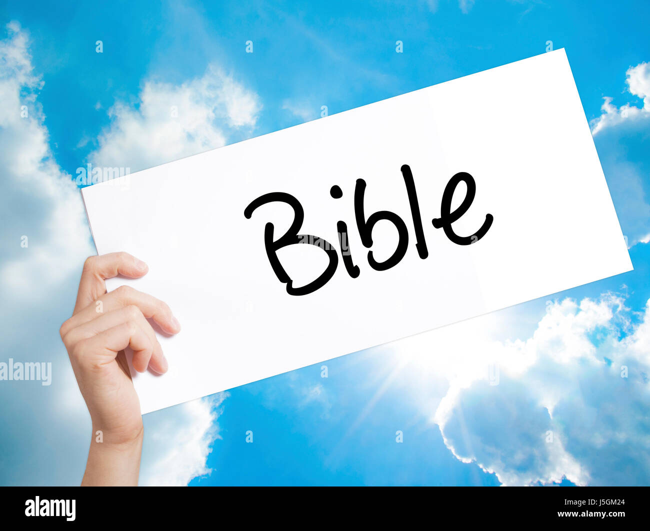 Bible Sign on white paper. Man Hand Holding Paper with text. Isolated ...