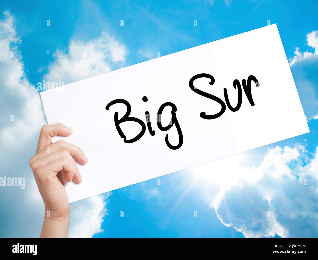 Big Sur Sign on white paper. Man Hand Holding Paper with text. Isolated ...