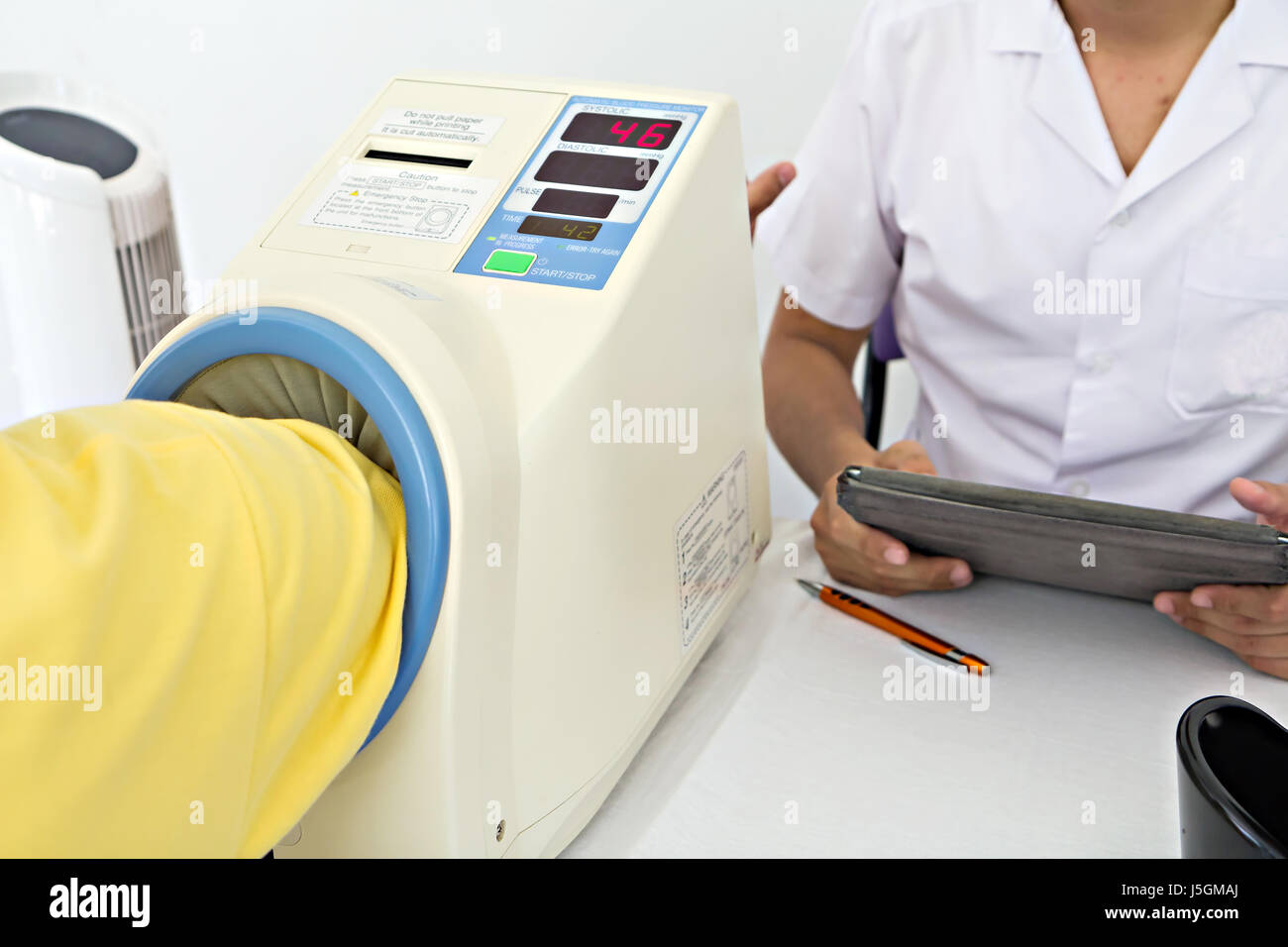Automatic blood pressure monitor for health check Stock Photo - Alamy