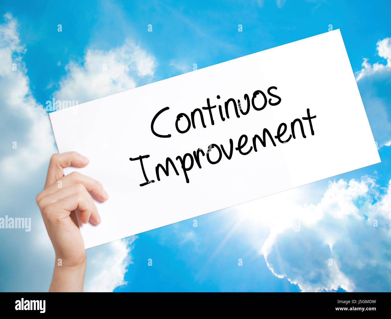 Continuos Improvement Sign on white paper. Man Hand Holding Paper with ...