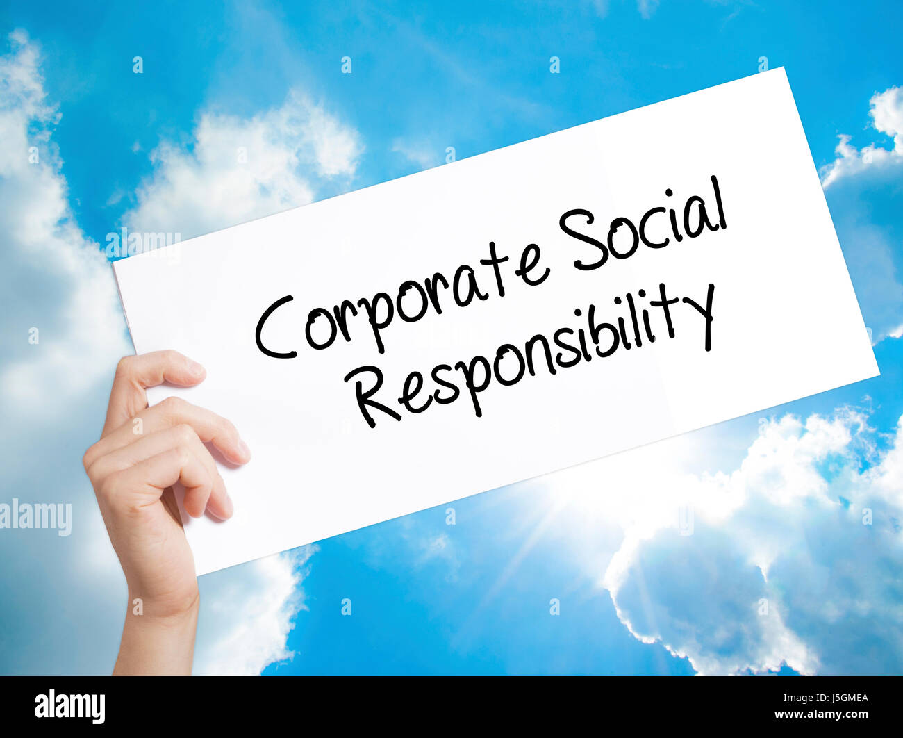 Corporate Social Responsibility Sign on white paper. Man Hand Holding ...