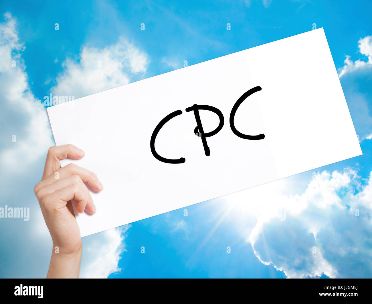 CPC (Cost Per Click) Sign on white paper. Man Hand Holding Paper with ...