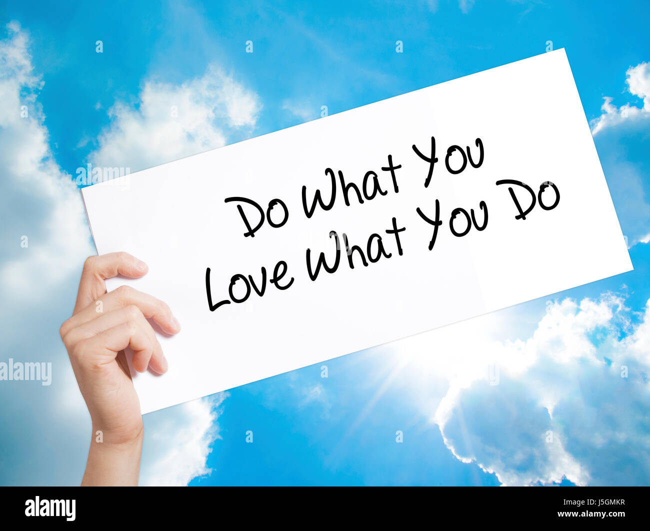 Do What You Love What You Do Sign on white paper. Man Hand Holding ...