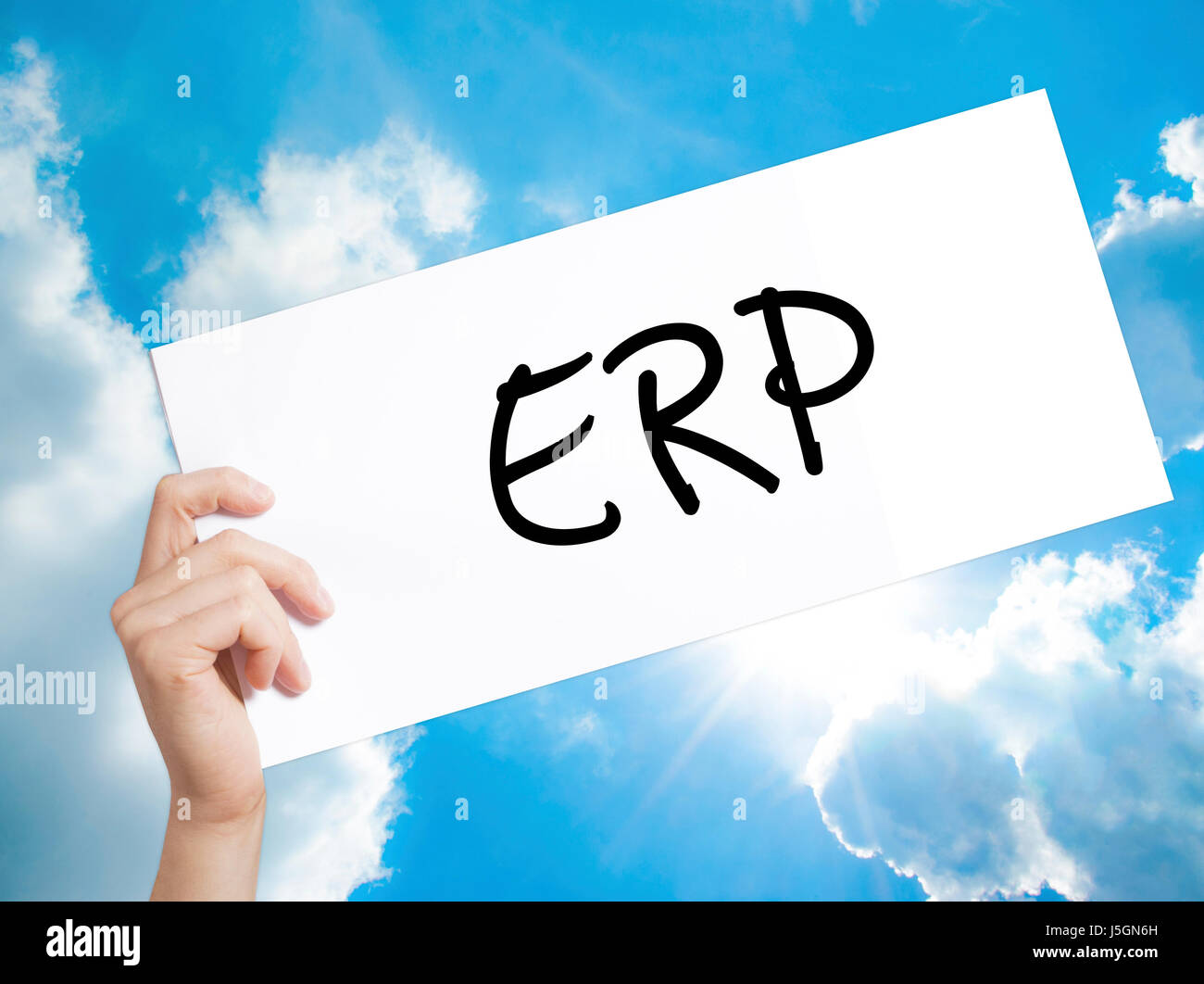 ERP (Enterprise Resource Planning) Sign on white paper. Man Hand ...