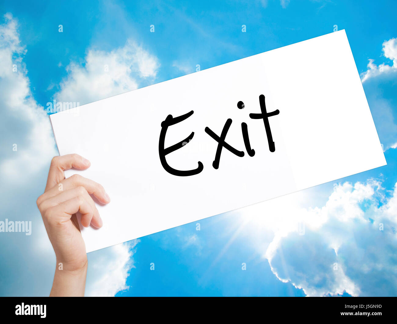 Exit Sign on white paper. Man Hand Holding Paper with text. Isolated on ...