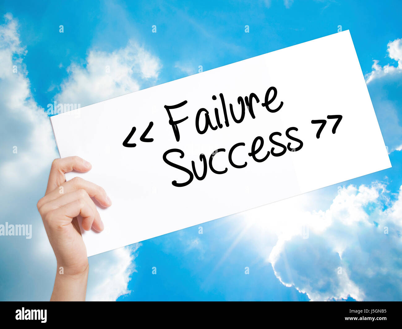 Failure Success Sign on white paper. Man Hand Holding Paper with text ...
