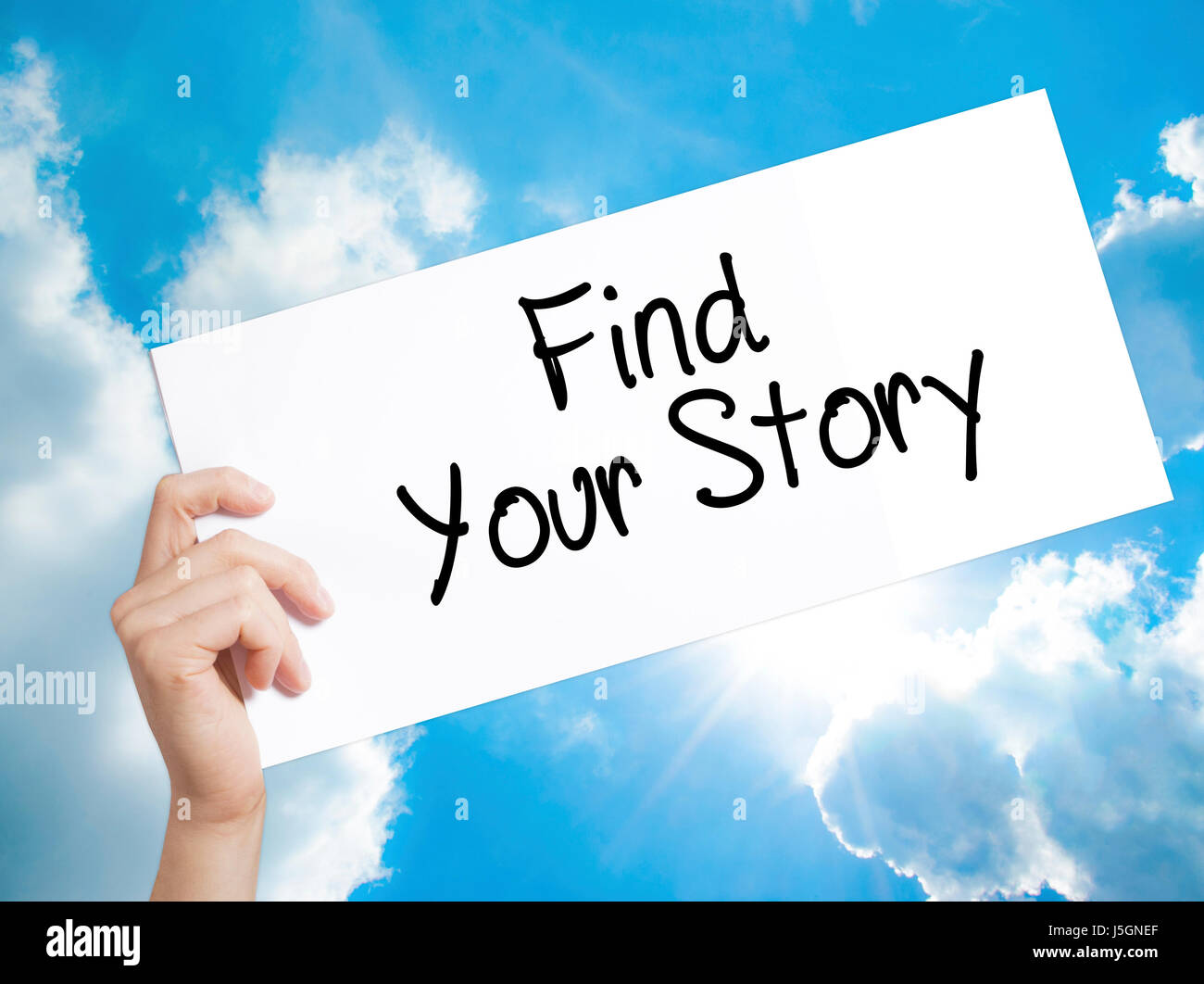 Find Your Story Sign on white paper. Man Hand Holding Paper with text ...