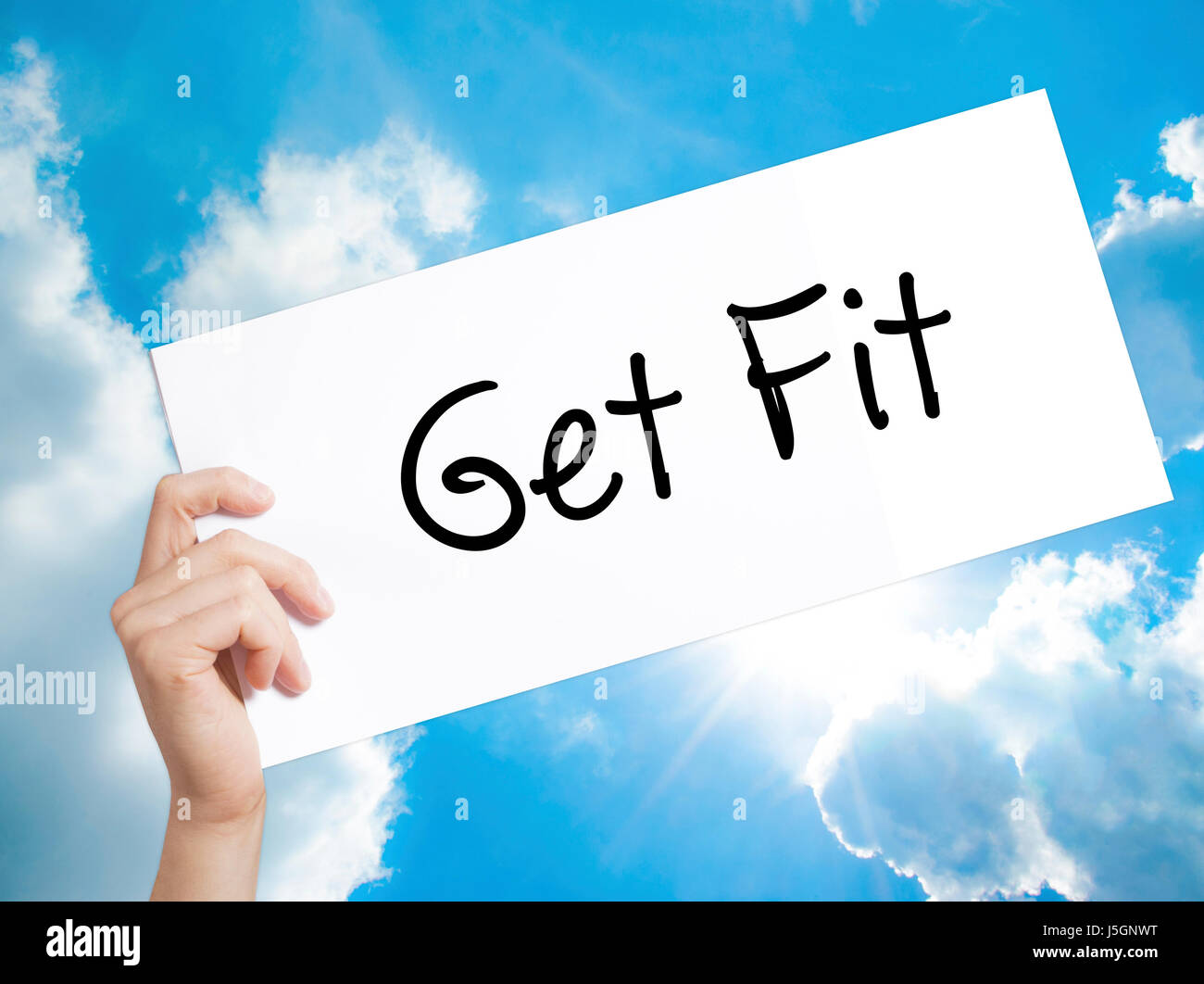 Get Fit Sign on white paper. Man Hand Holding Paper with text. Isolated ...
