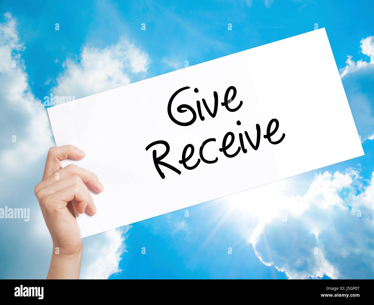 Give Receive Sign on white paper. Man Hand Holding Paper with text ...