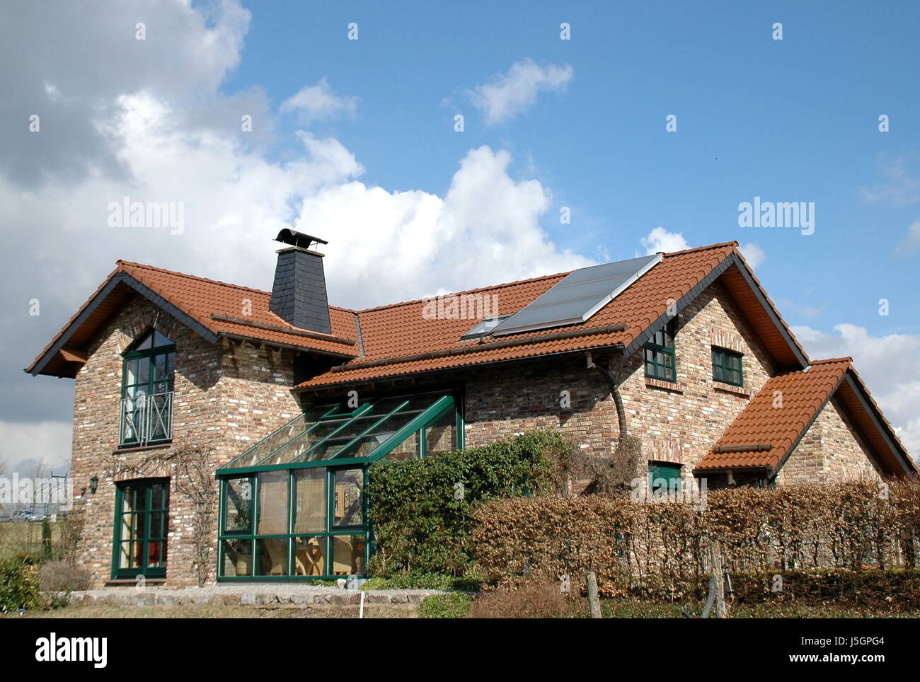 house with conservatory and solar Stock Photo - Alamy