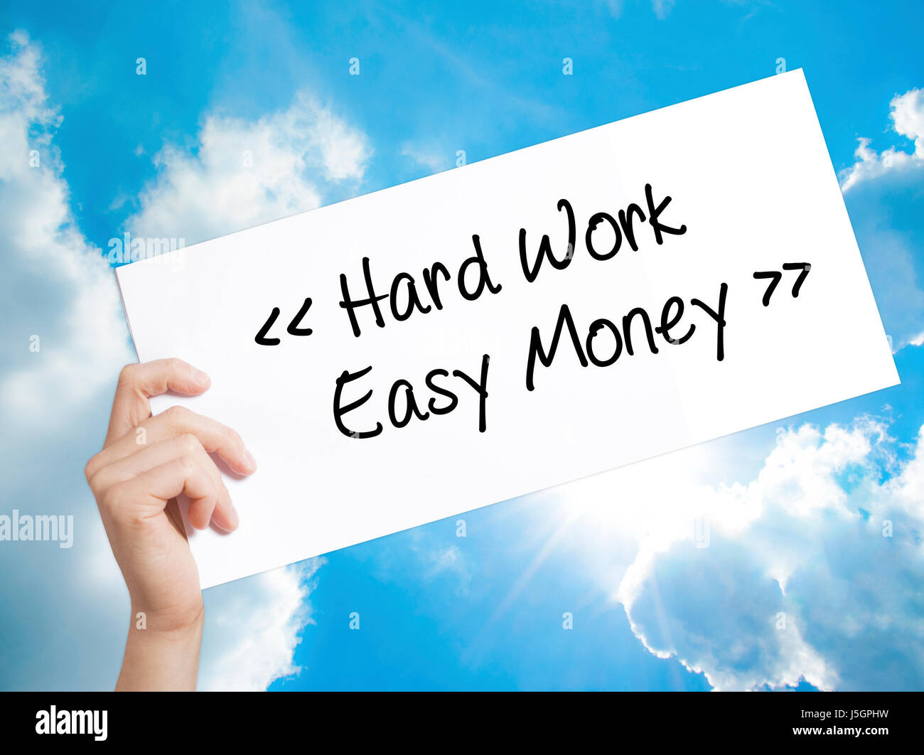 Hard Work - Easy Money Sign on white paper. Man Hand Holding Paper with ...