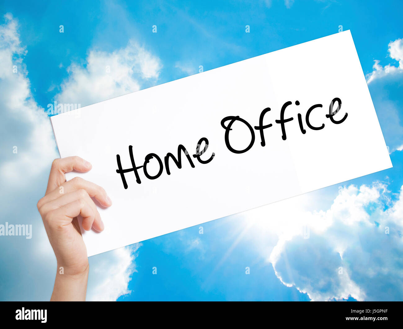 Home Office Sign on white paper. Man Hand Holding Paper with text ...