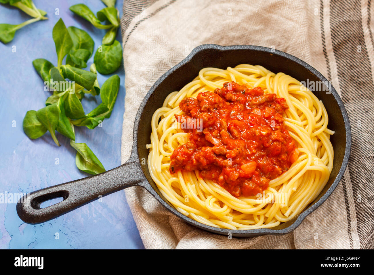 Pasta Bolognese in a cast-iron frying pan Stock Photo - Alamy