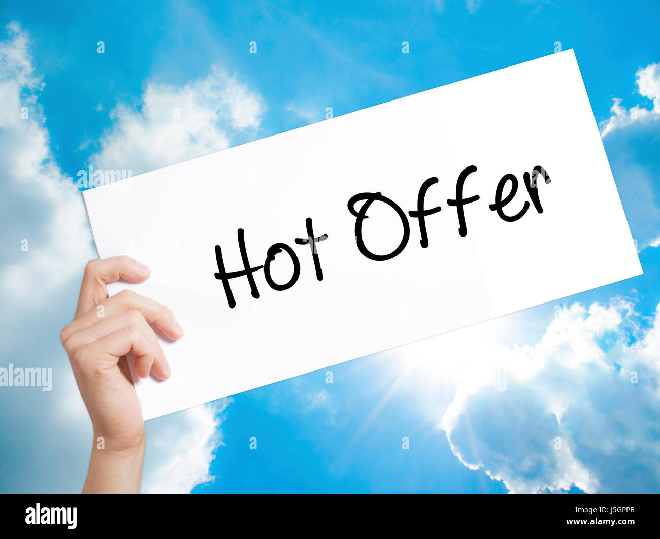 Hot Offer Sign on white paper. Man Hand Holding Paper with text ...