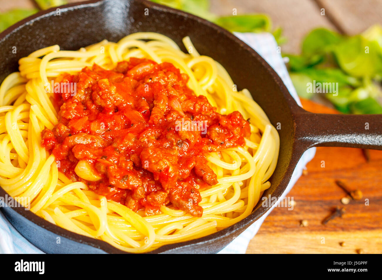 Pasta Bolognese in a cast-iron frying pan Stock Photo - Alamy