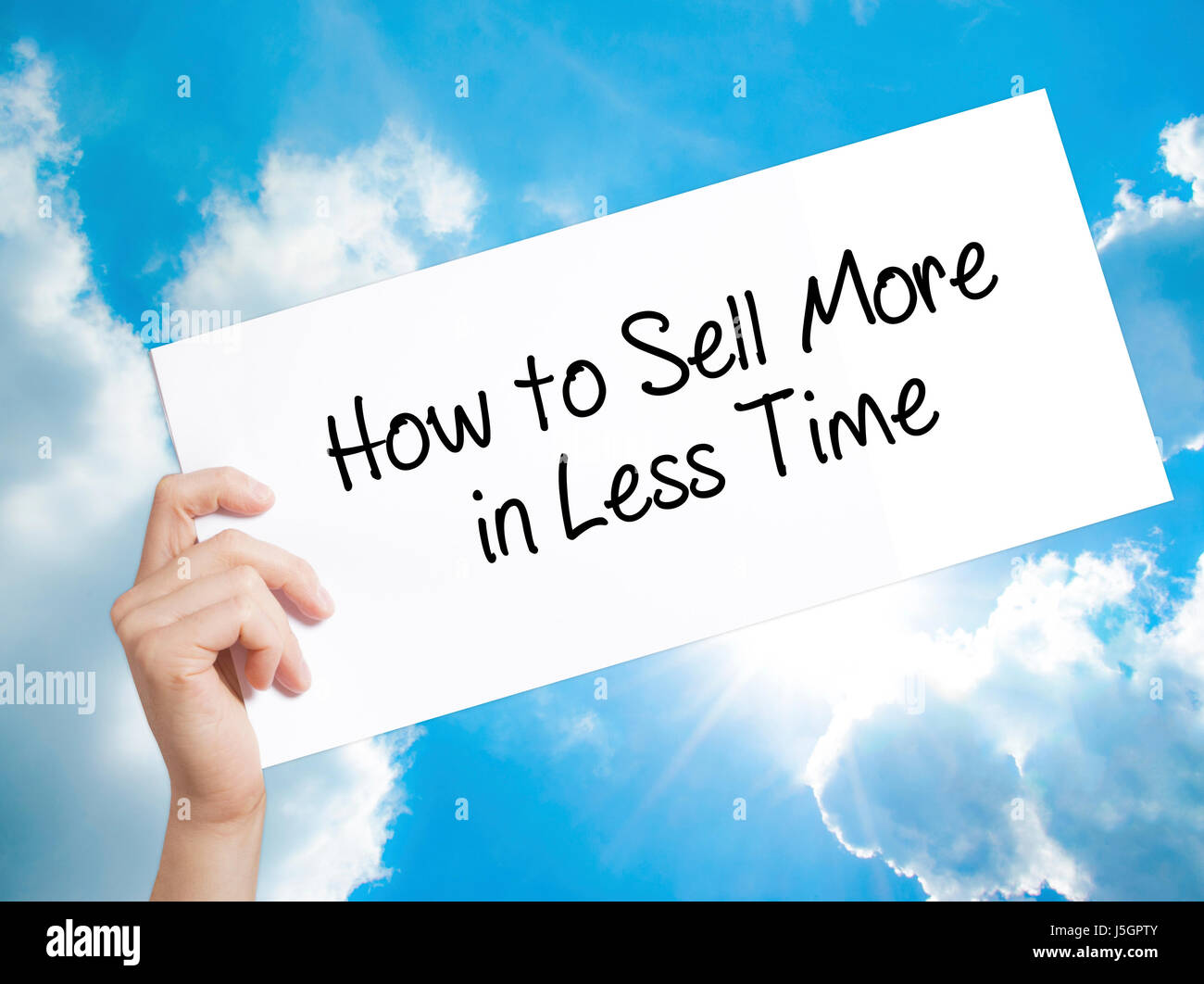 How to Sell More in Less Time Sign on white paper. Man Hand Holding ...
