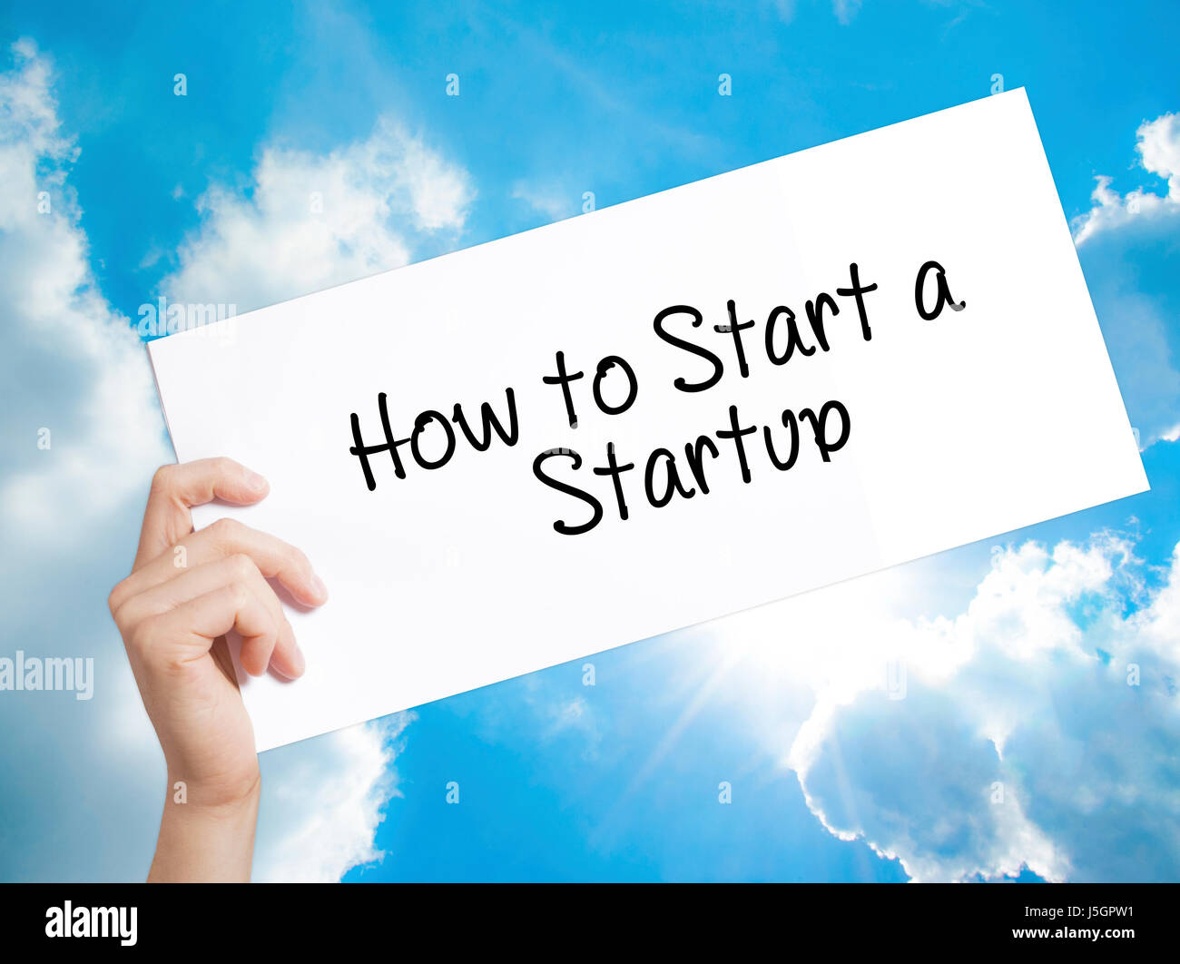How to Start a Startup Sign on white paper. Man Hand Holding Paper with ...