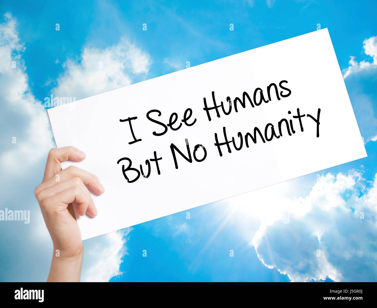 I See Humans But No Humanity Sign on white paper. Man Hand Holding ...