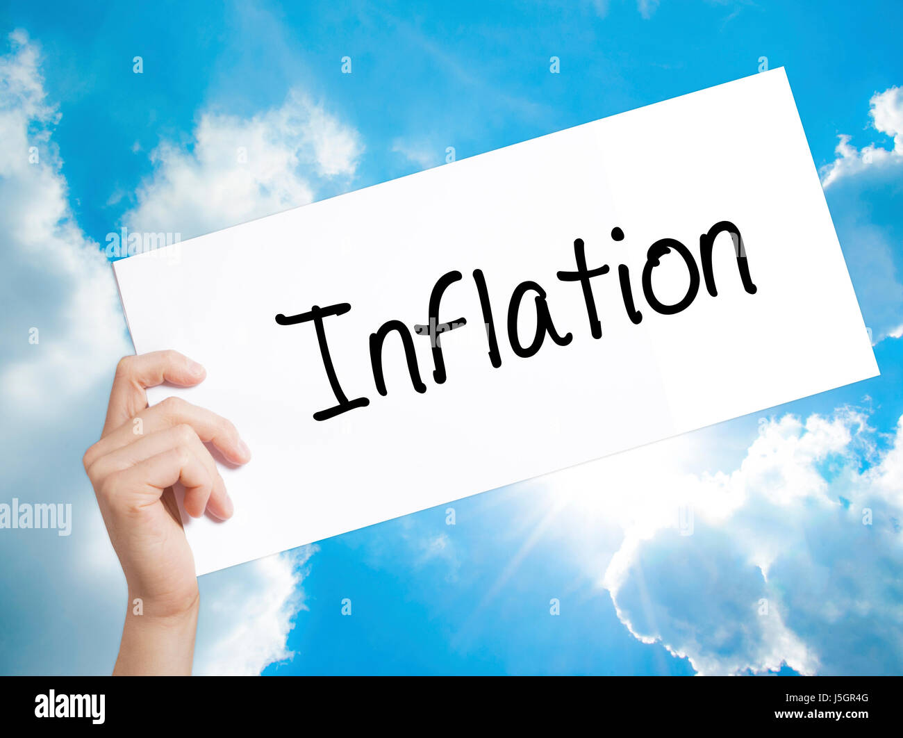 Inflation Sign on white paper. Man Hand Holding Paper with text ...