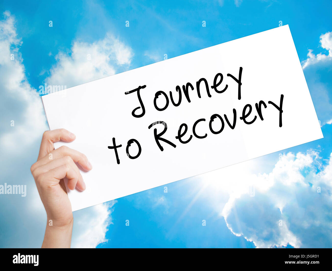 Journey to Recovery Sign on white paper. Man Hand Holding Paper with ...