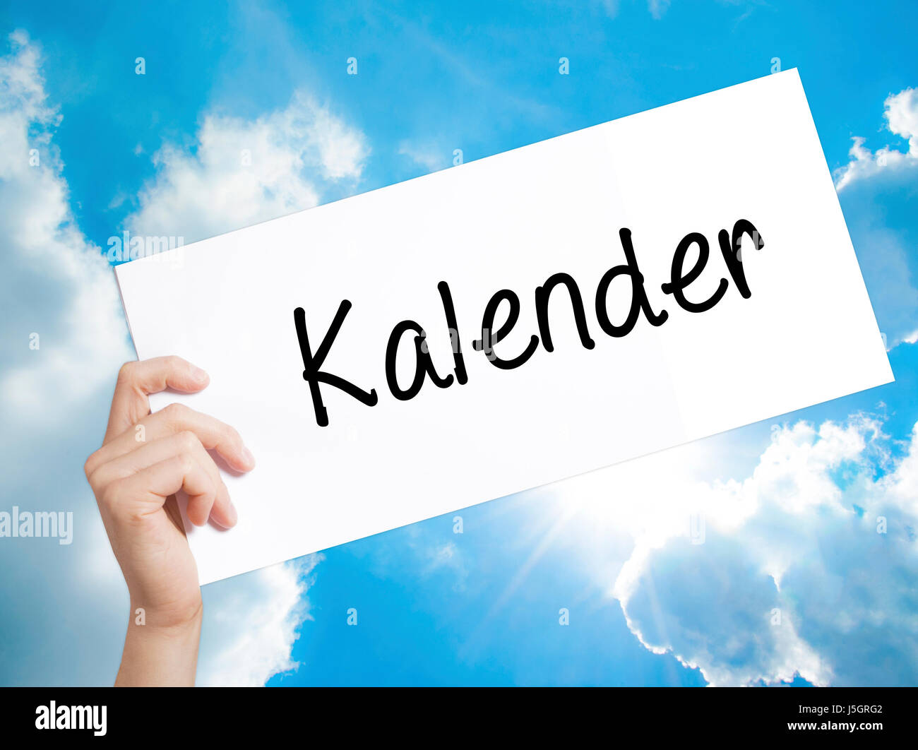 Kalender (Calendar in German) Sign on white paper. Man Hand Holding ...